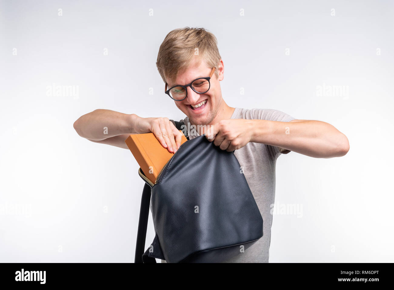 Education, university, people concept - male student put his thing for ...