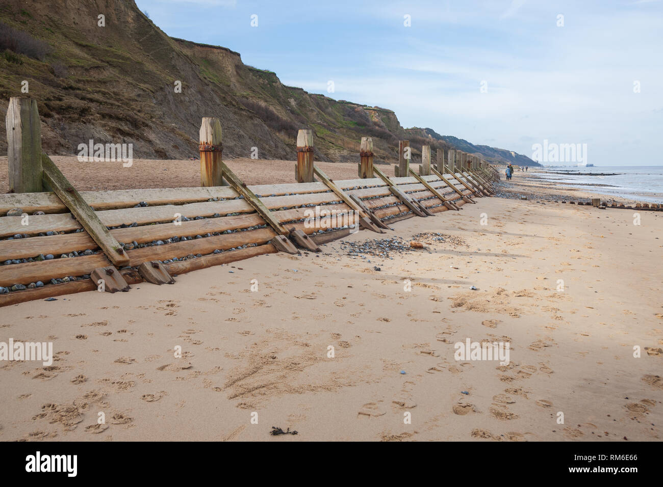wooden beach groynes, coastal sea defences at overstrand on the norfolk ...
