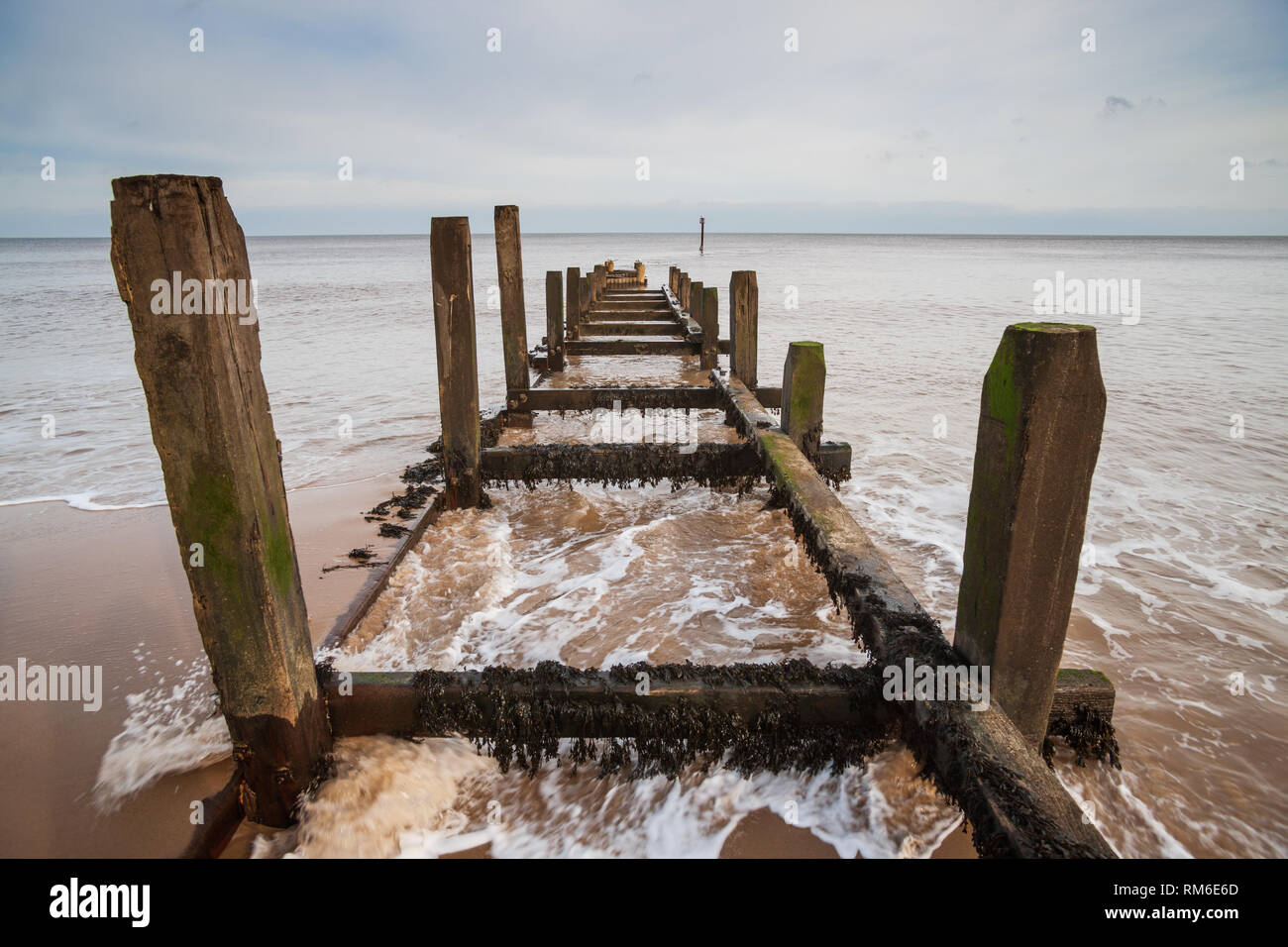 wooden beach groynes, coastal sea defences at overstrand on the norfolk ...