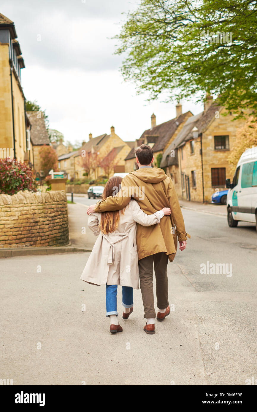 Rear view of a silhouette of a loving couple, hugging while visiting a ...
