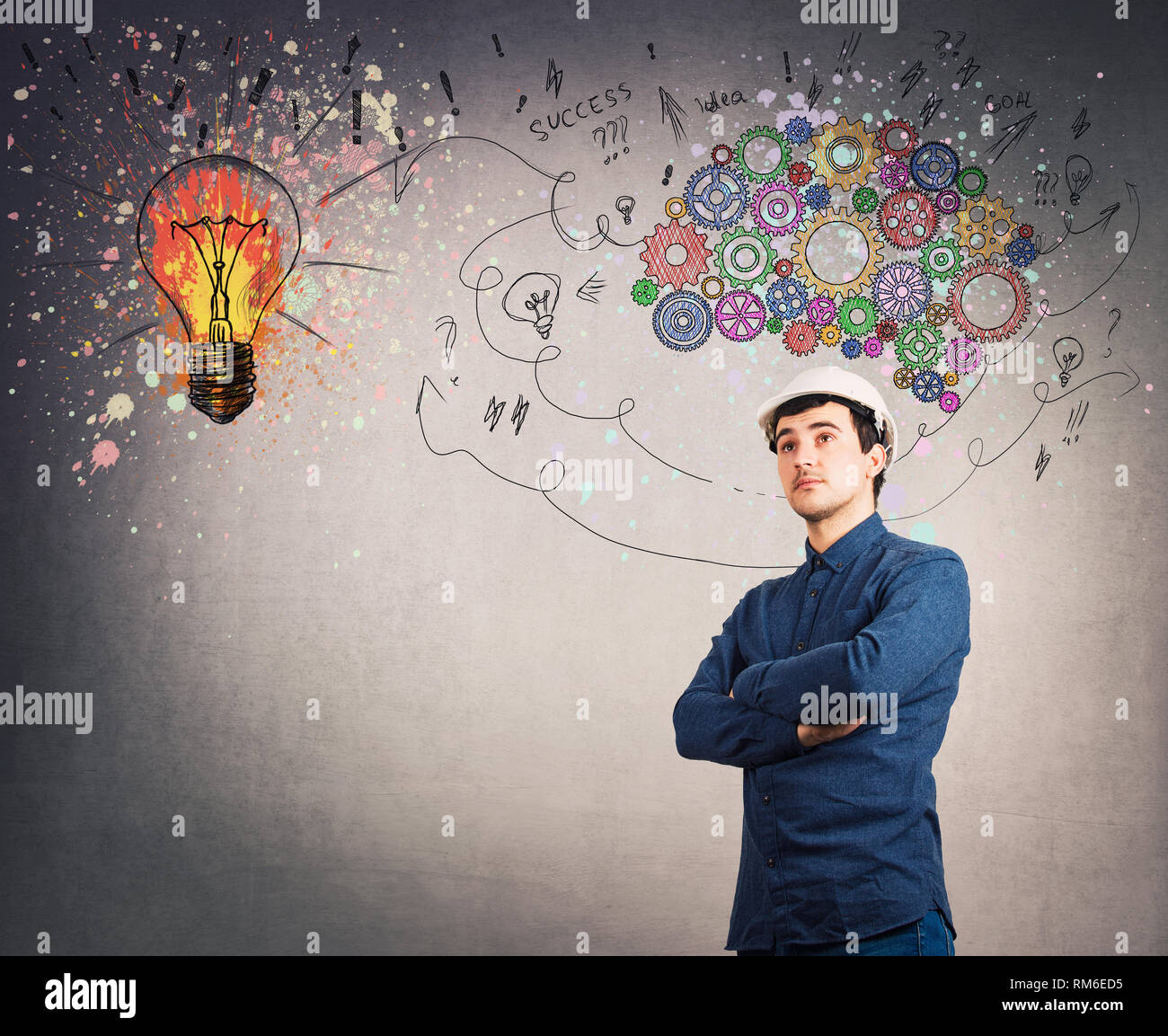 Confident man engineer wearing protective helmet, hands crossed over ...