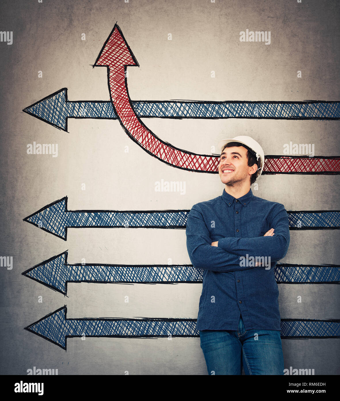 Man engineer holding hands crossed imaginning arrows sketch, one of ...