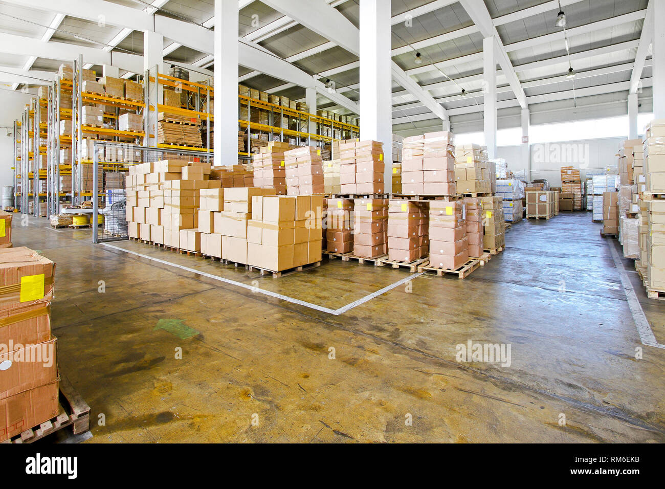Interior of big warehouse with lot of boxes Stock Photo - Alamy