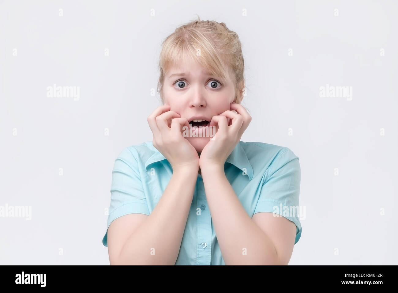 Scared female face hi-res stock photography and images - Alamy