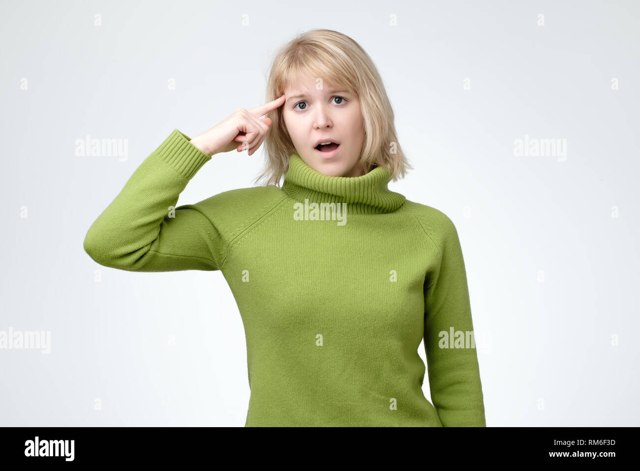 Finger to temple hi-res stock photography and images - Alamy