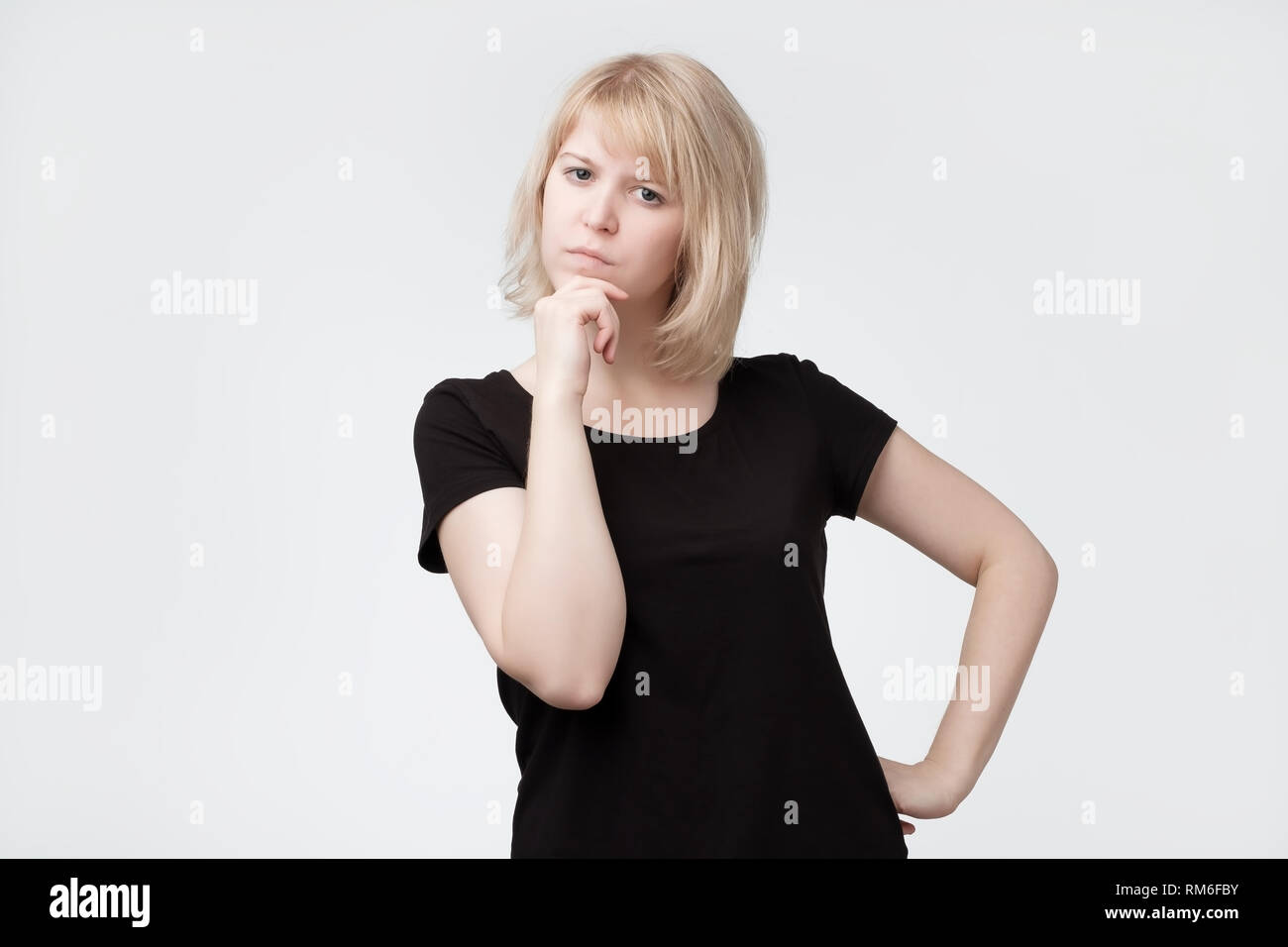 Teen girl looking at camera thinking hi-res stock photography and ...