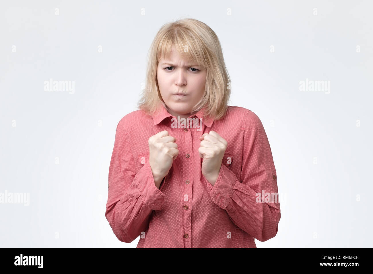 Emotive young female model looks nervously feels anxious Stock Photo ...