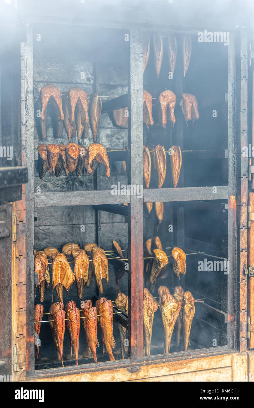 Traditionally hot smoked fishes in retro style smokehouse Stock Photo ...