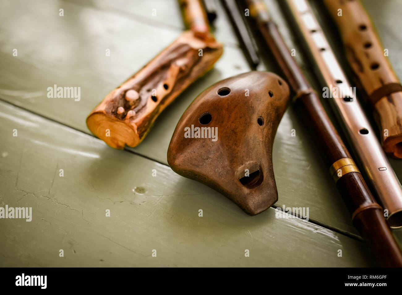 Different folk flutes from wood and steel Stock Photo - Alamy