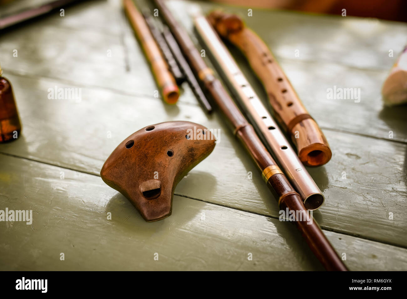 Different folk flutes from wood and steel Stock Photo - Alamy