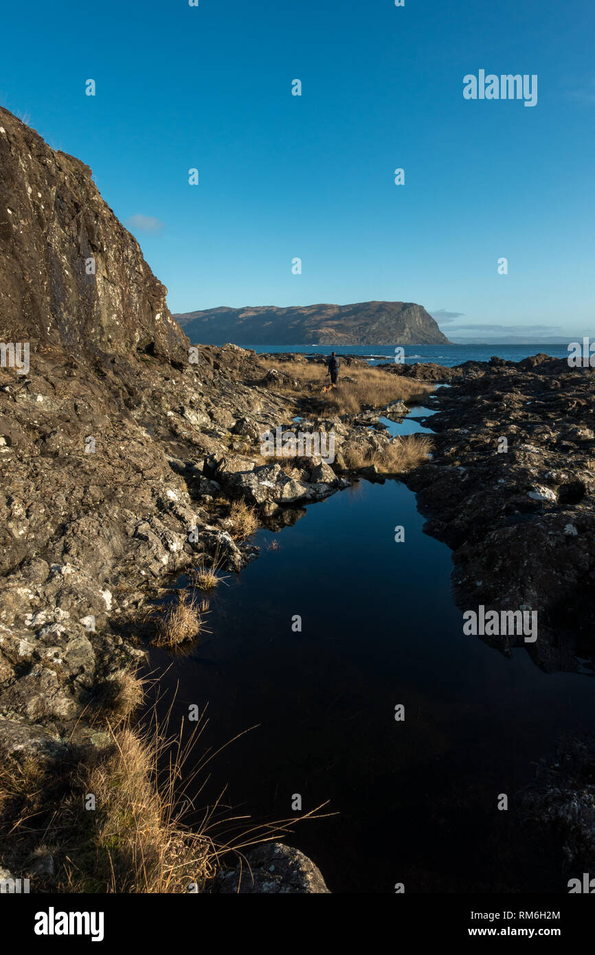 Person walking the coastal path from Carsaig to Lochbuie past stunning ...