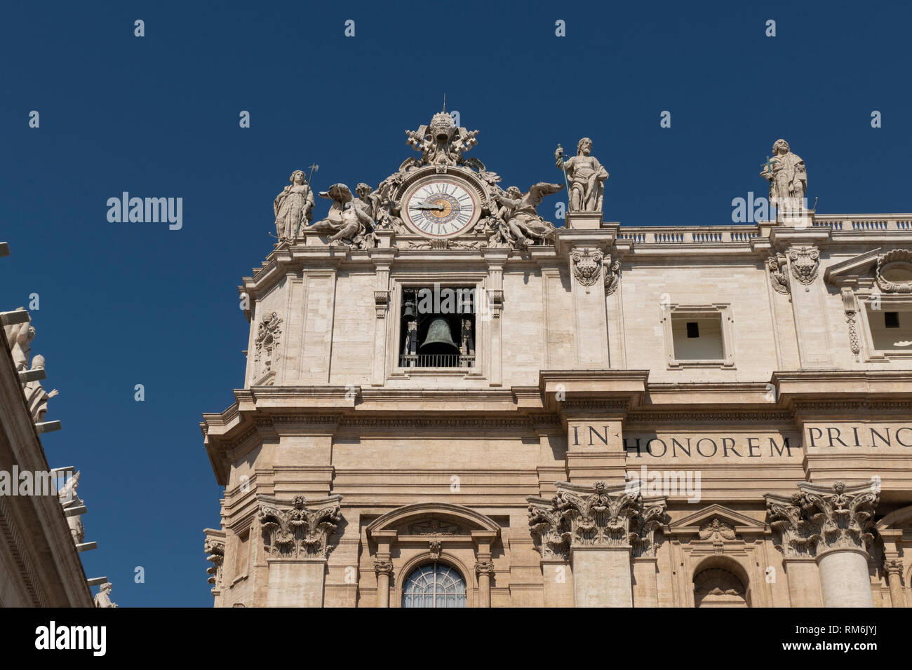 Detail of the facade and the left clock of St. Peter's Basilica, San ...