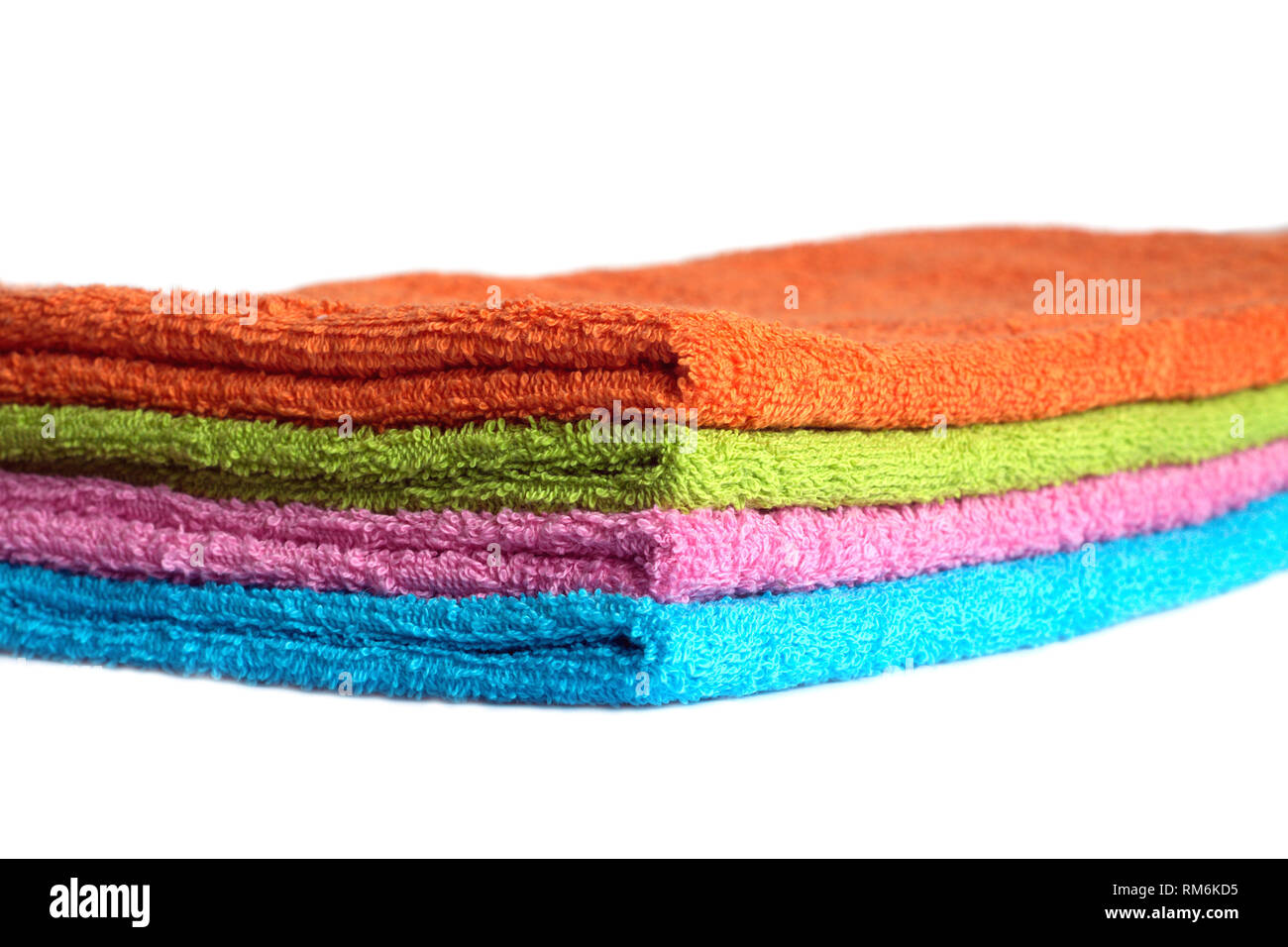 Four clean soft double bath towels set of different colors stacked ...