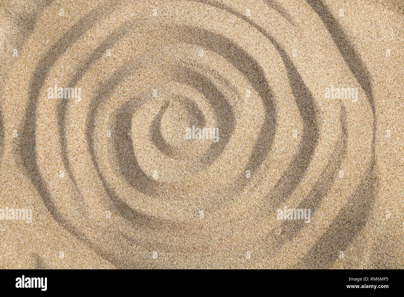 Sand swirl on a beach Stock Photo - Alamy