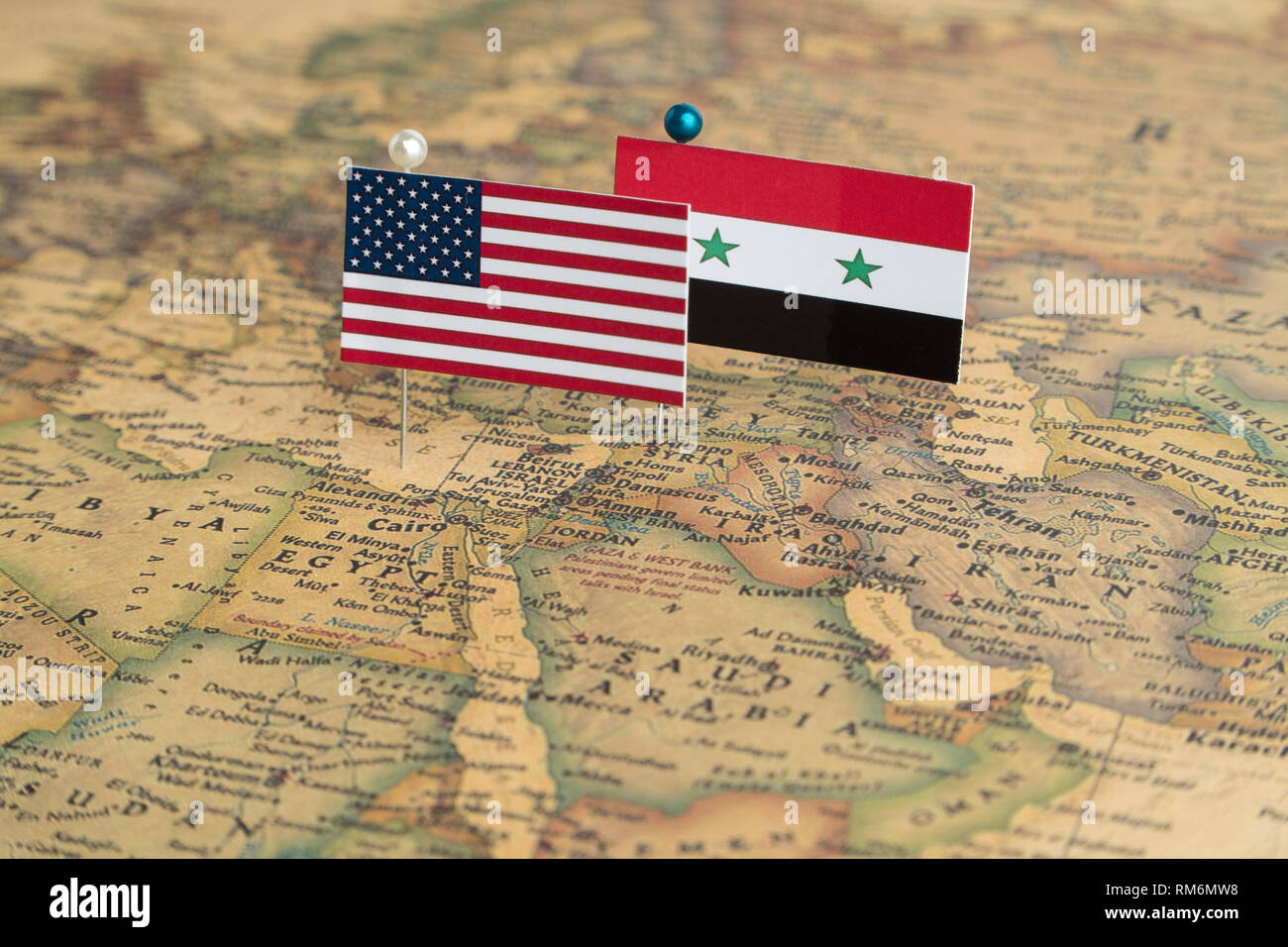 Flags of the USA and Syria on the world map. Conceptual photo, politics ...