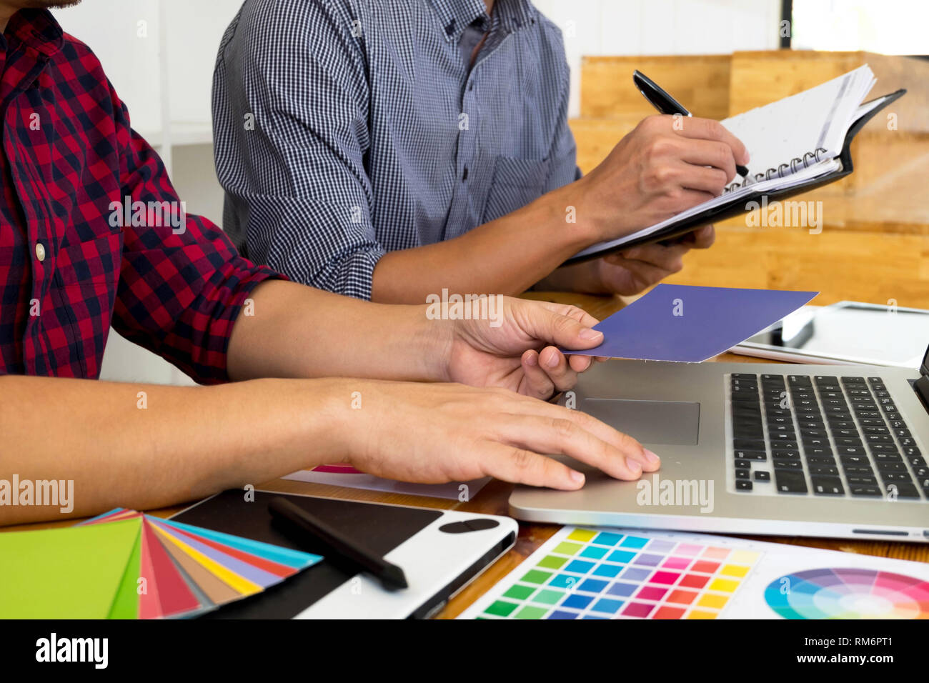 Graphic designers choose colors from the color bands samples for design ...
