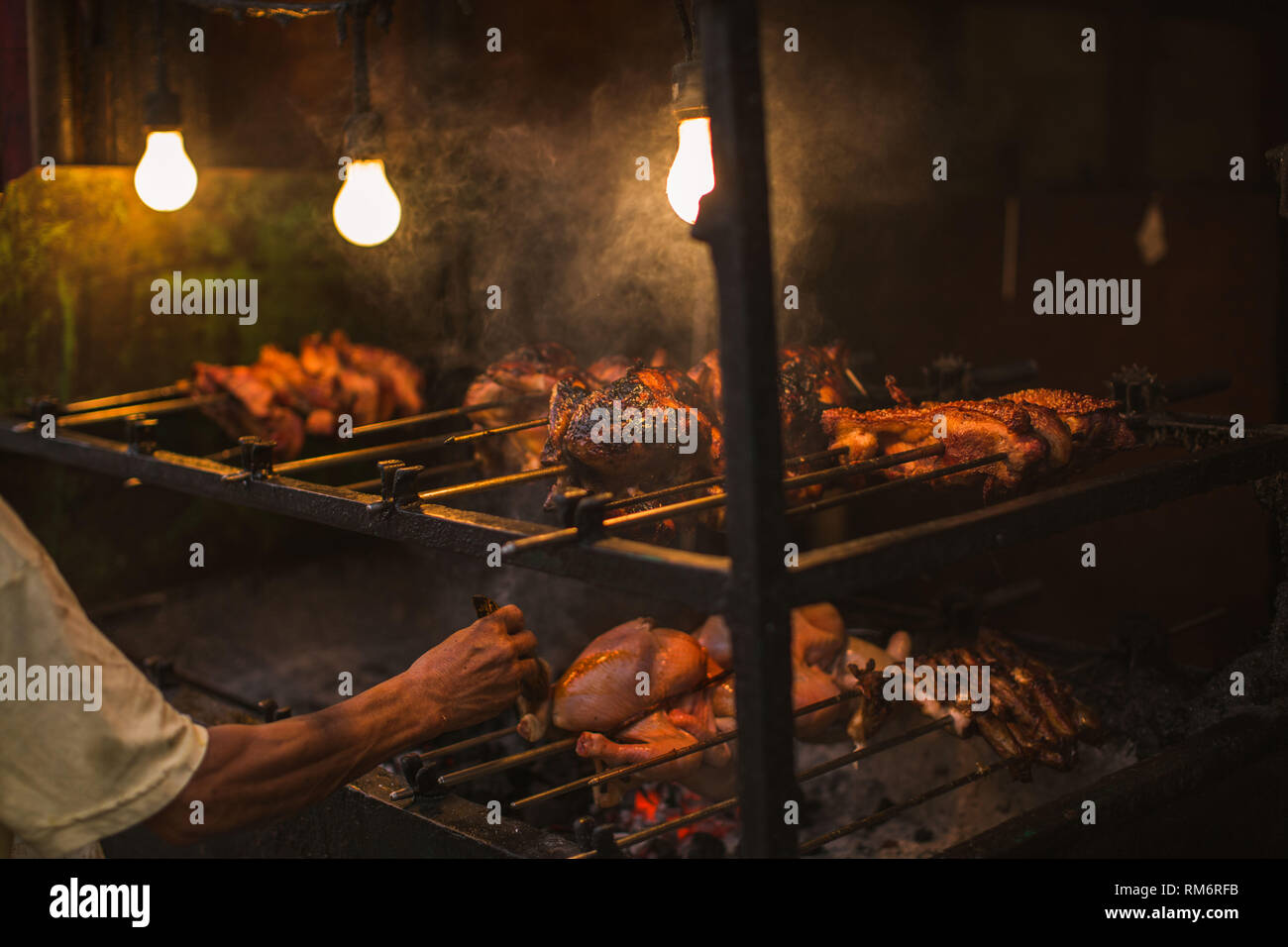 outdoor street chicken barbecue grill with broiler spit roasted over ...