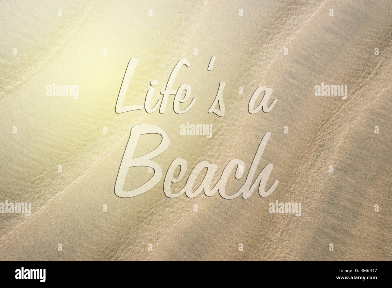 full frame image of a beach sand with LIFE'S A BEACH word. concept of ...