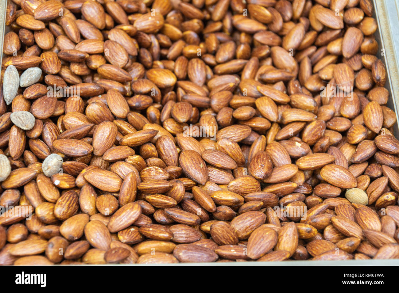 Pile of almond at a market Stock Photo - Alamy