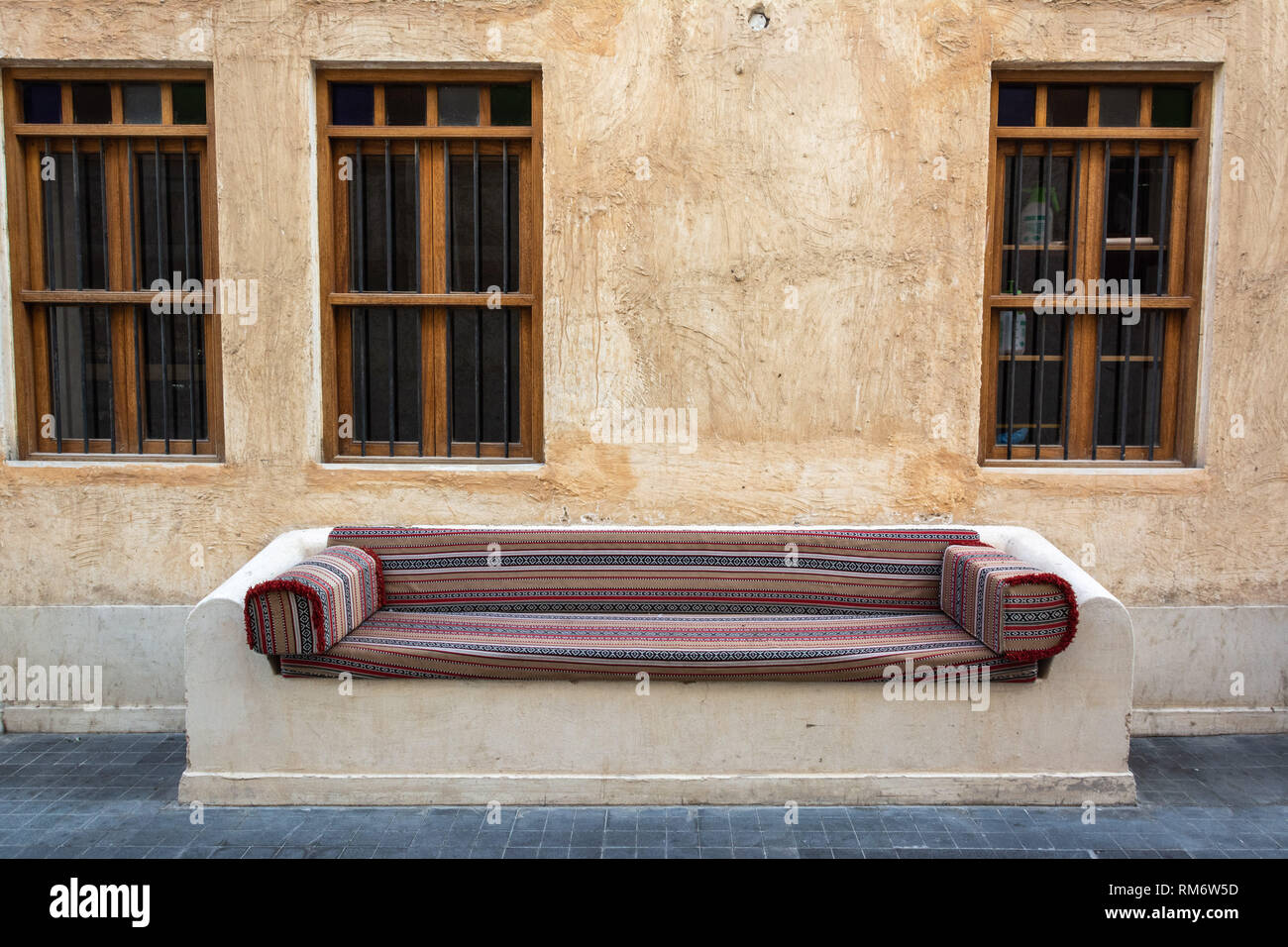 Street bench covered with ornate seat cushion in Doha, Qatar Stock ...