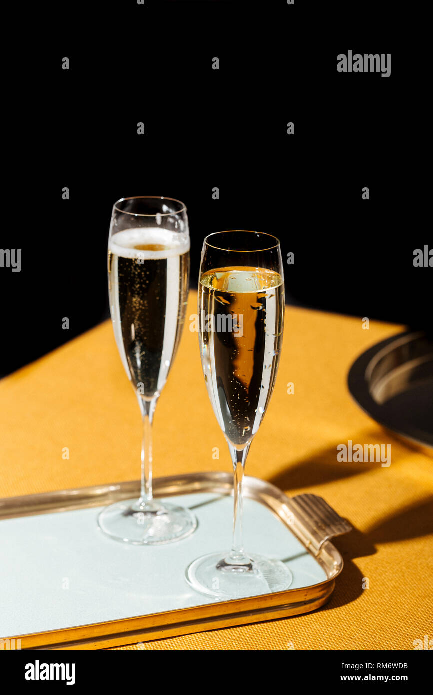 Flutes filled with sparkling Prosecco, in pop contemporary style ...