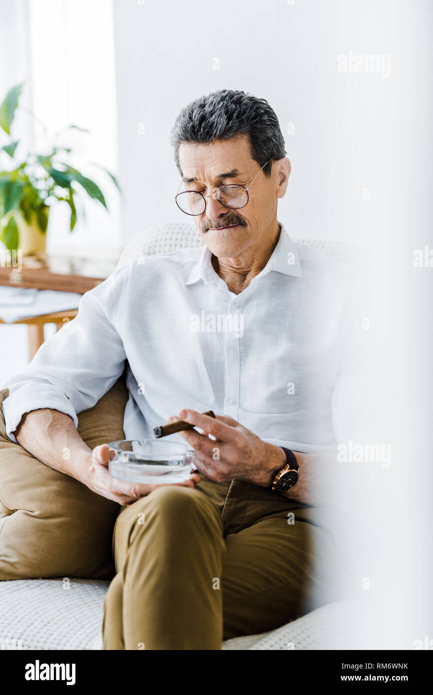 senior man holding sigar and ashtray in hands Stock Photo - Alamy