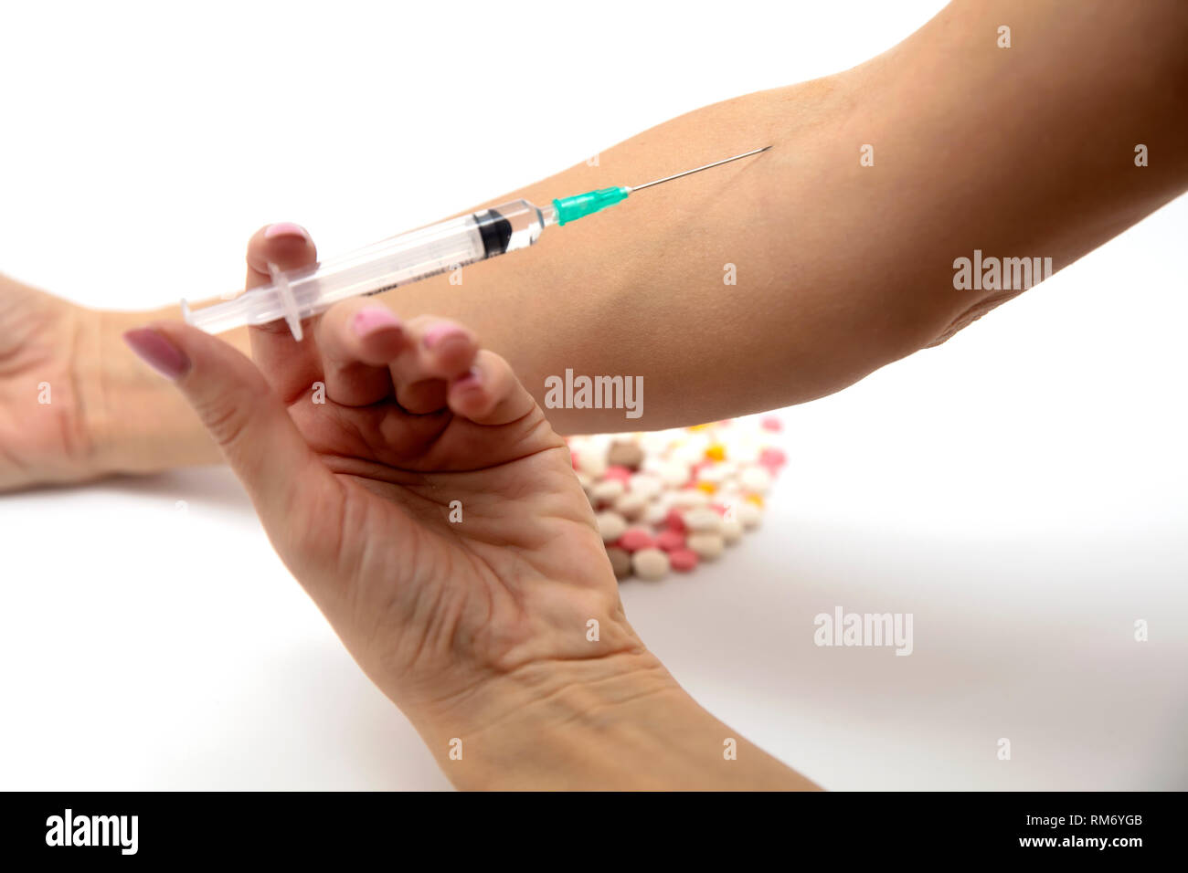Woman gives her an injection in her hand against white background Stock ...