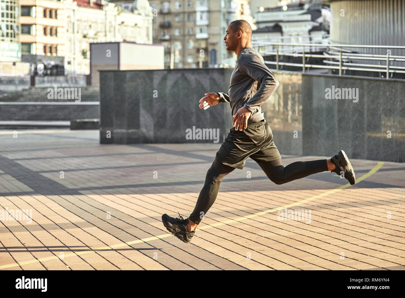 Full of energy Full length portrait of athletic african man running ...