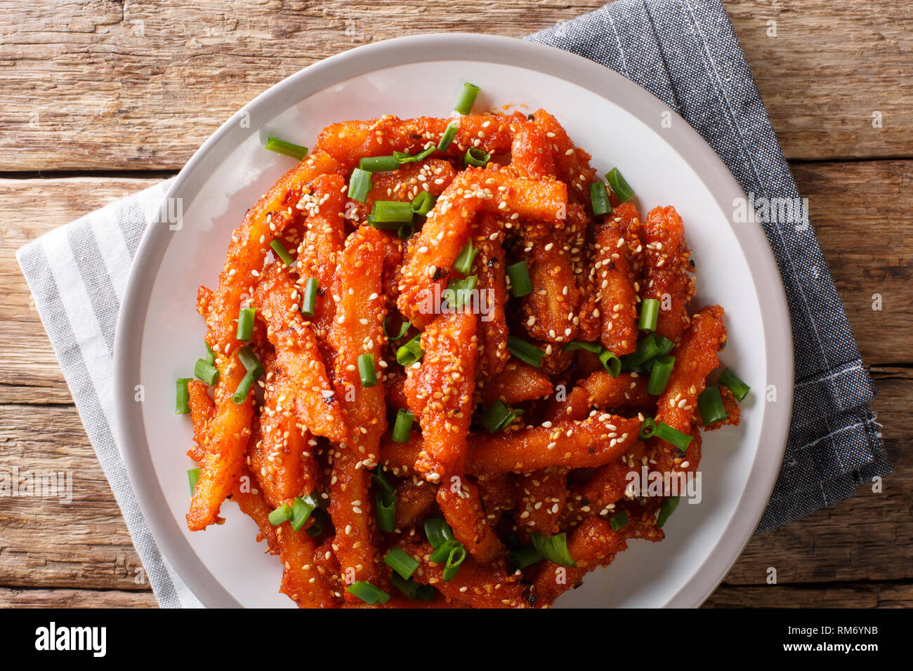 Crispy Honey Chilli Potatoes Delicious spicy snack on a plate close-up ...
