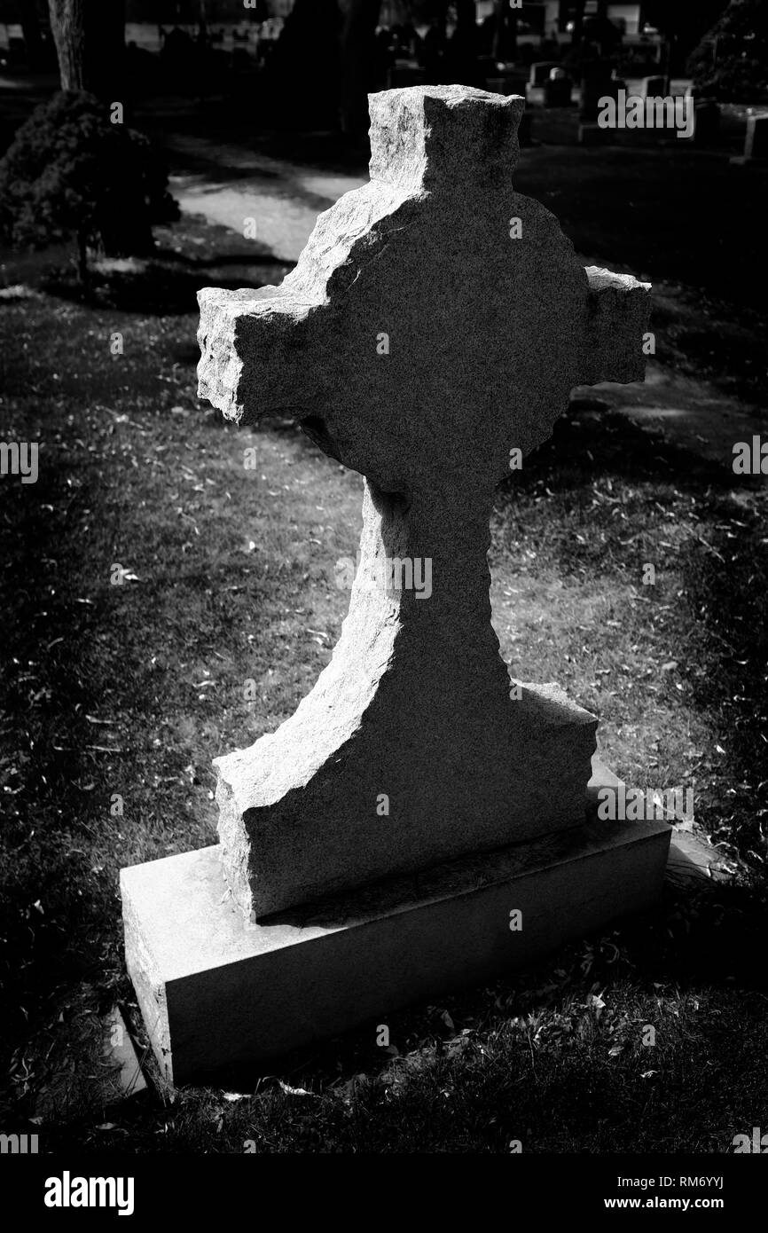 Gravestone cross in cemetery representing death marker grave stone ...