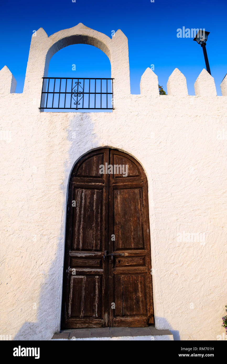 Rustic door and Moorish arch in Castillo de Comares, Axarquia ...