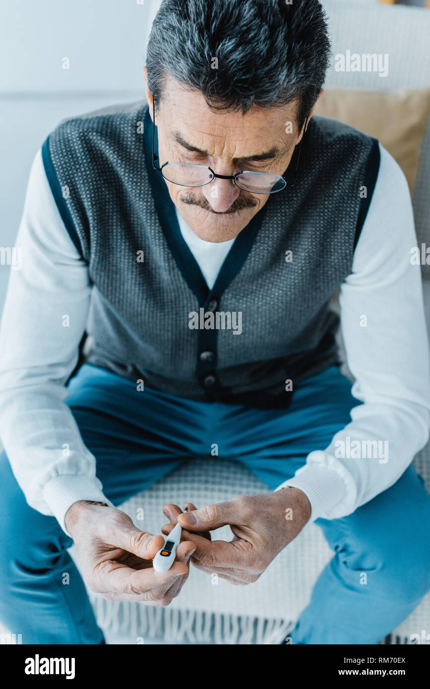 Elderly man thermometer in hi-res stock photography and images - Alamy