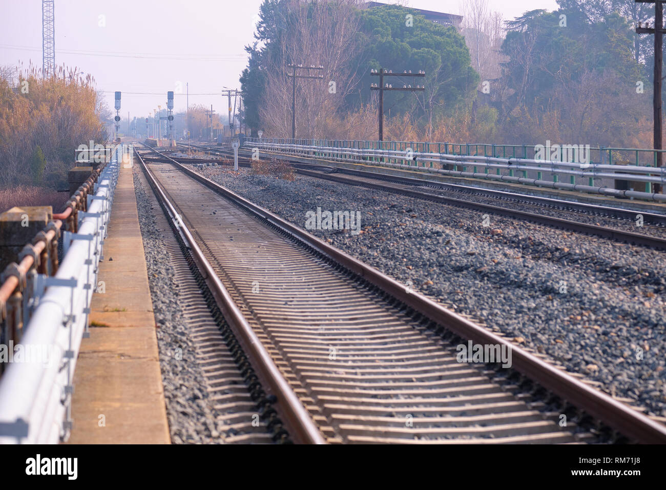 View of two parallel tracks on the railway near a station Stock Photo ...