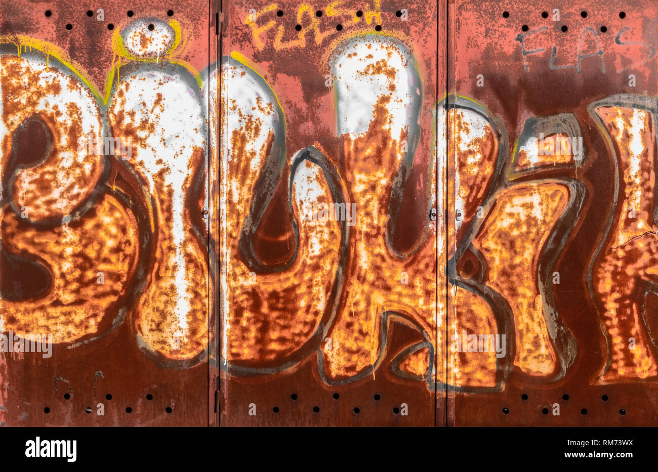 Graffiti on rusty metal surface. Ideal for concepts and backgrounds ...