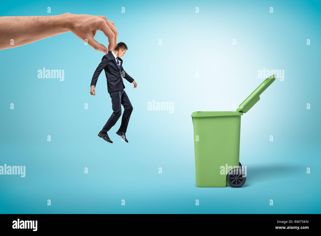 Big male hand throwing little businessman into green garbage bin on ...