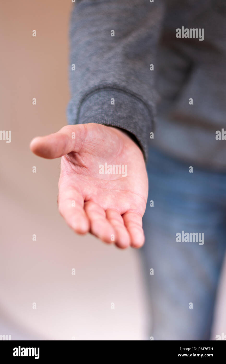 Hand reaching out for a handshake Stock Photo - Alamy