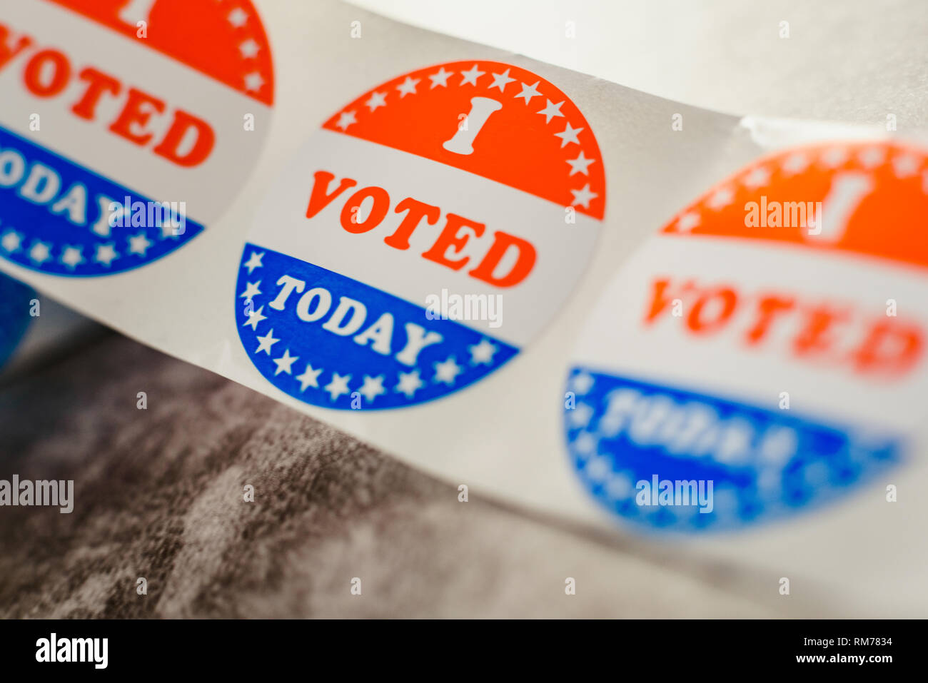 Roll of "I voted" circular stickers on a gray background for the ...
