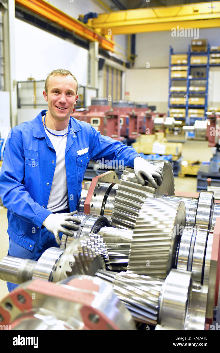 portrait of young cheerful workers in mechanical engineering Stock ...
