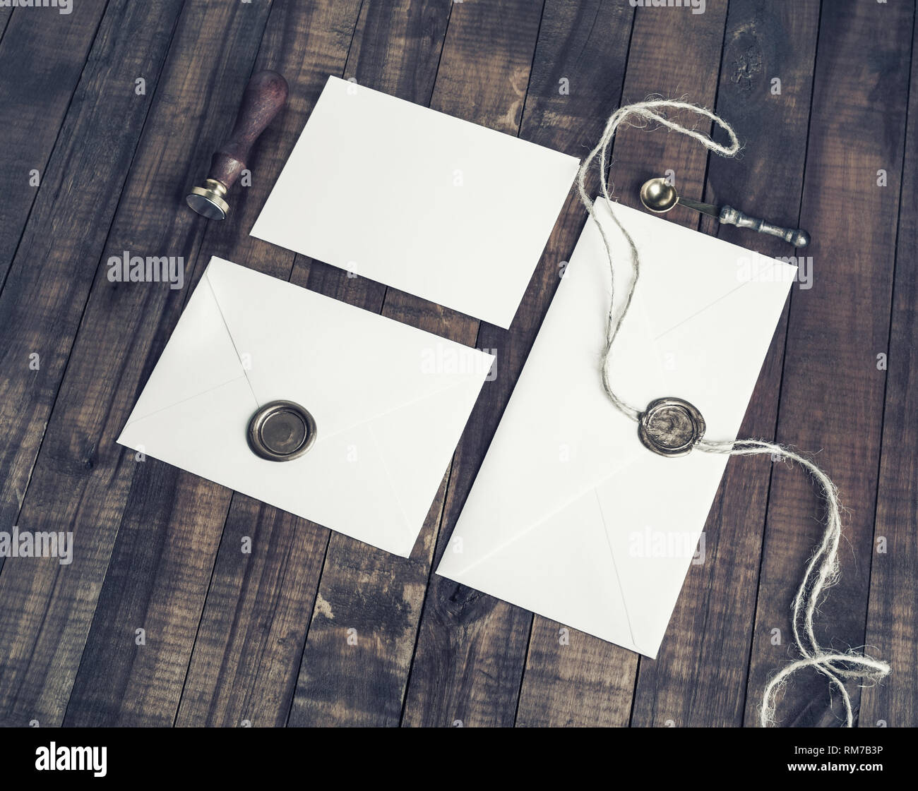 Blank envelopes and retro stationery on wooden background Stock Photo ...