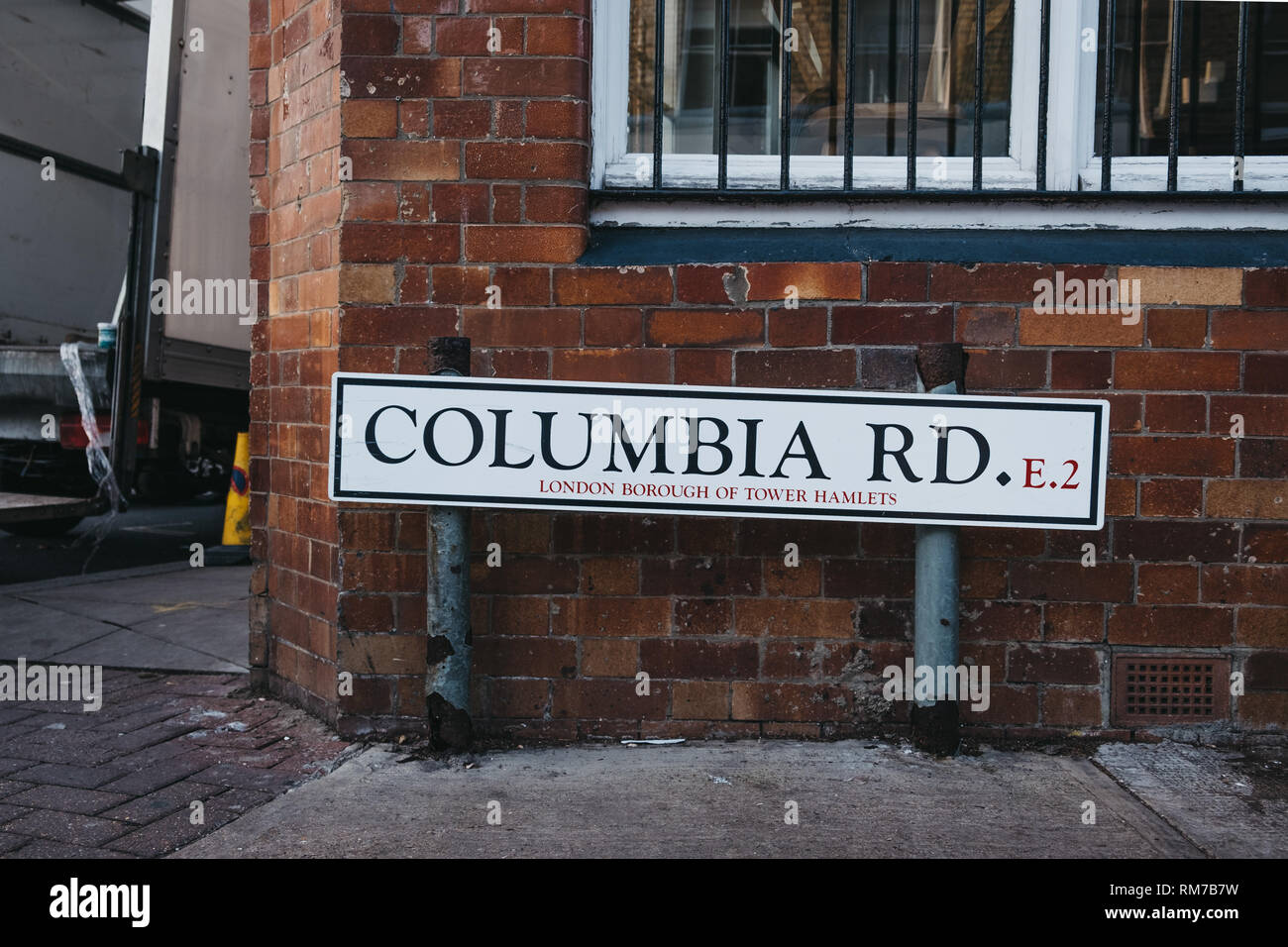 Metal Columbia Road street name sign against the brick wall in London ...