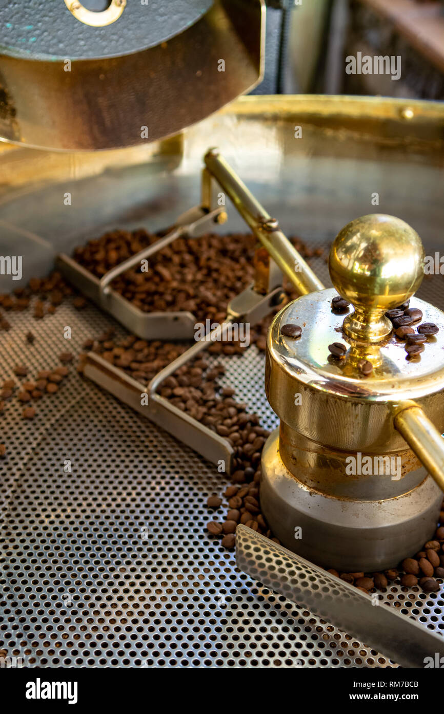 Traditional method of roasting dried organic arabica coffee beans in ...