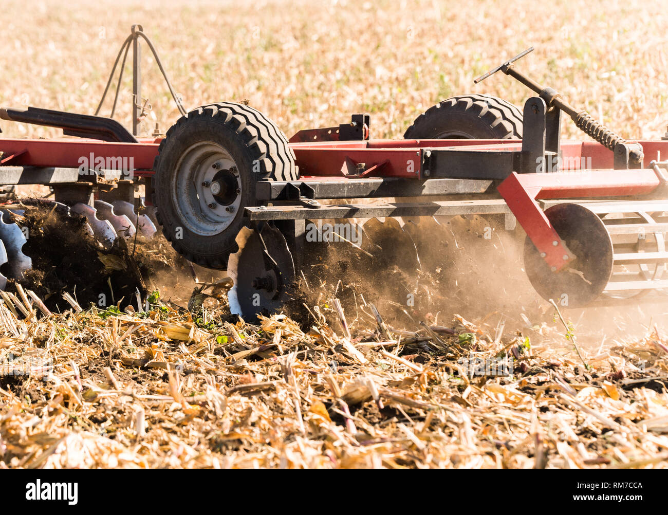 Tractors plowing stubble fields Stock Photo - Alamy