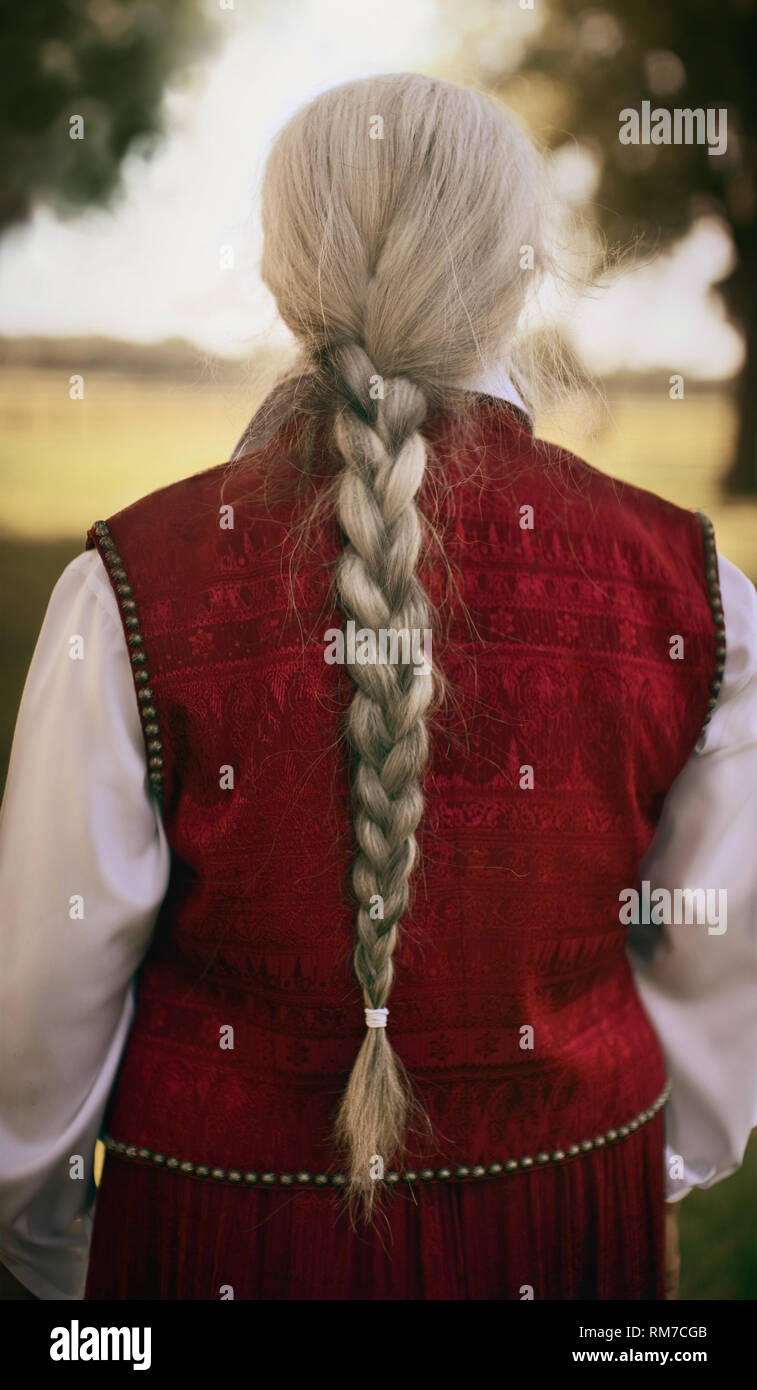 Rear view of an old lady with a long braid Stock Photo - Alamy