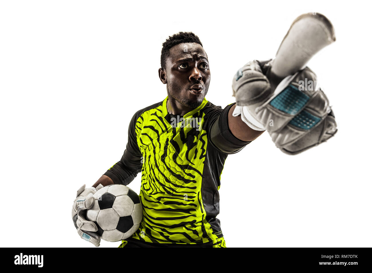 One african male soccer player goalkeeper pointing away and screaming ...