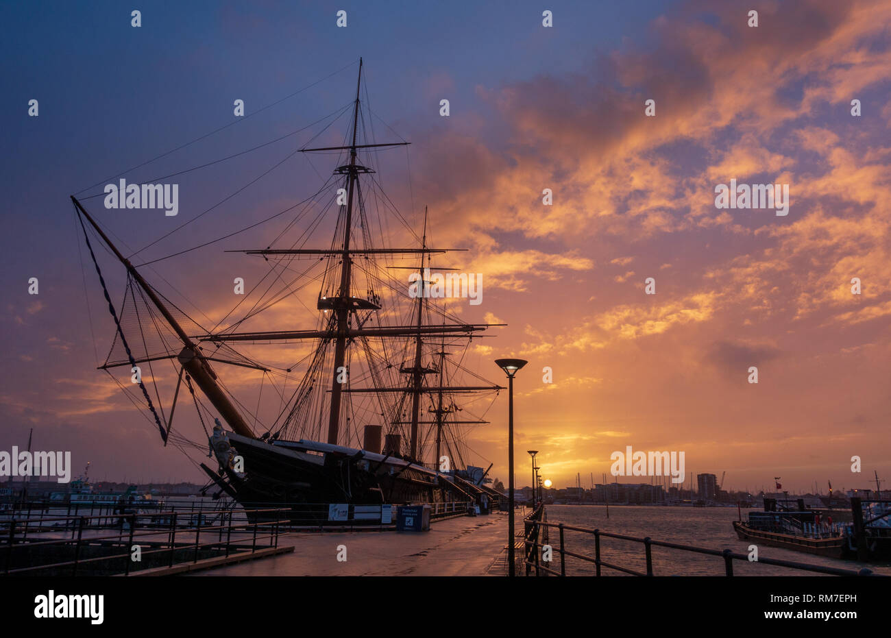 Historic warship HMS Warrior at sunset, Portsmouth Historic Dockyard ...