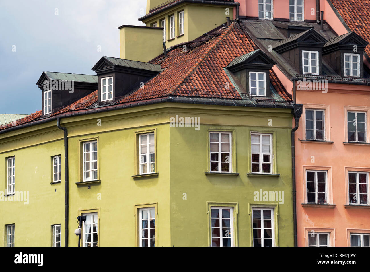 scenic color building facades with tile roofs in old city of Warsaw ...
