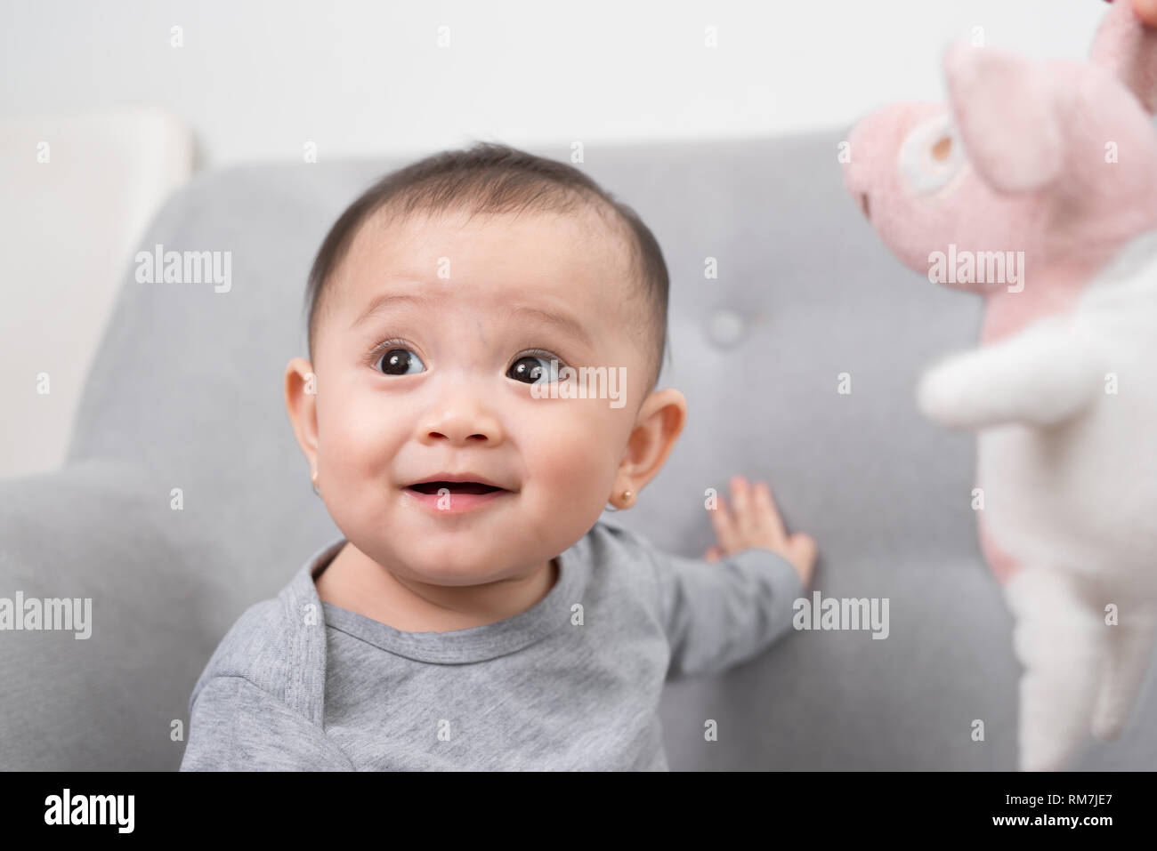 childhood, babyhood and people concept - happy little baby girl sitting ...