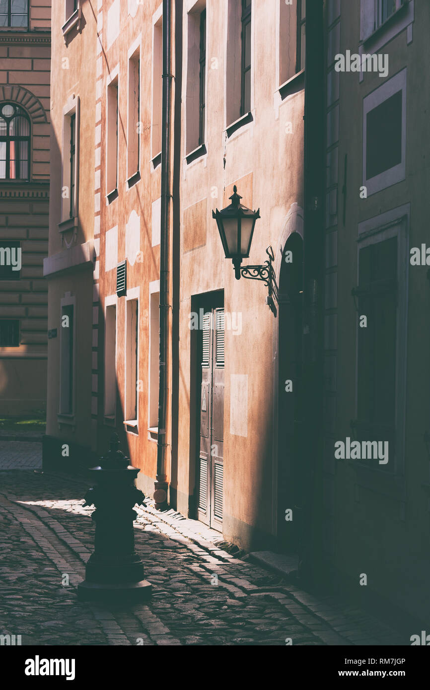 Light and shadow street in the old town Stock Photo - Alamy