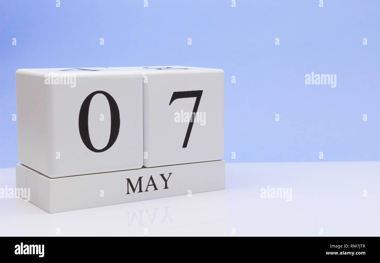 May 07st. Day 7 of month, daily calendar on white table with reflection ...