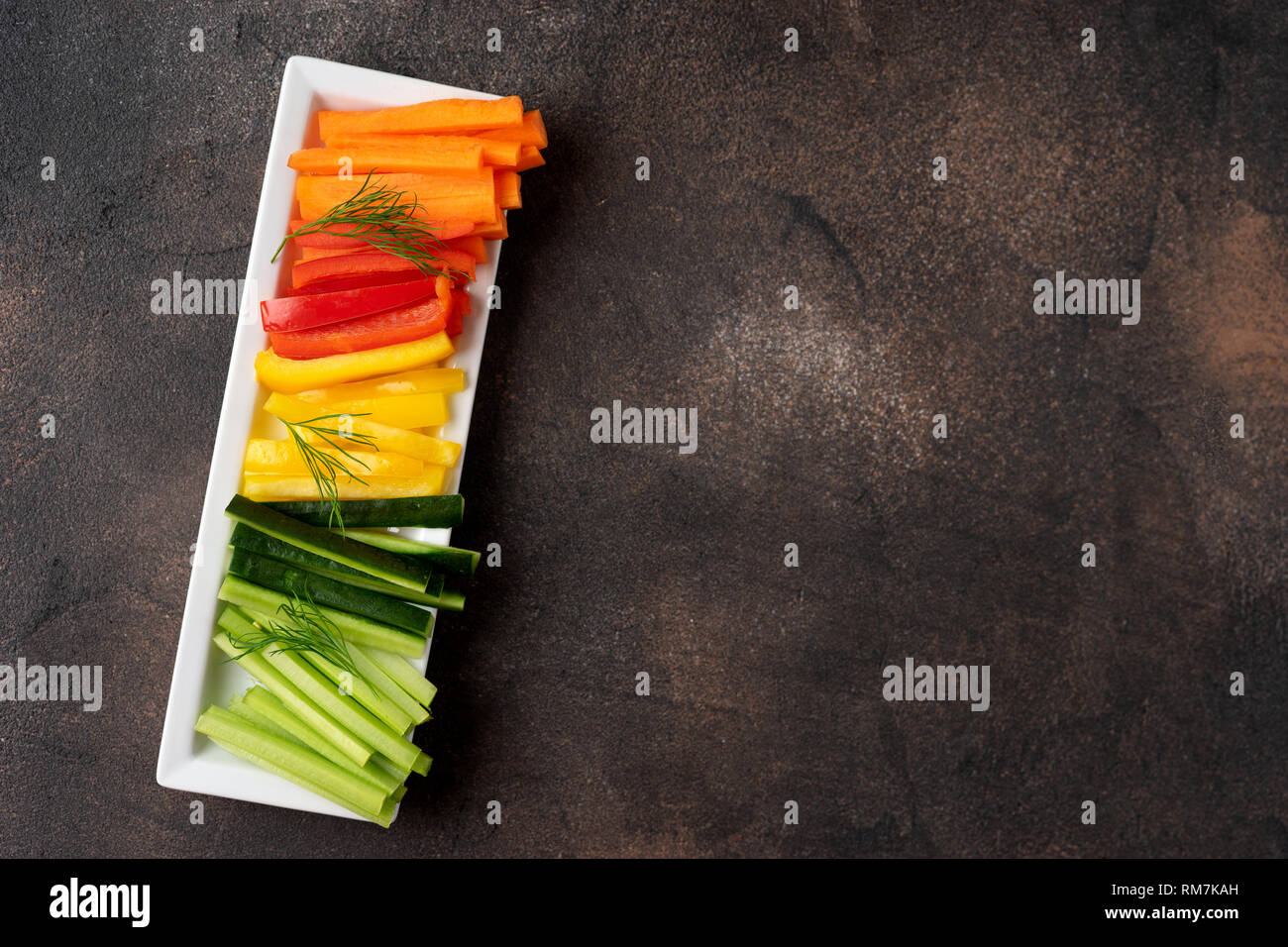 Colorful vegetable sticks in long plate. Top view Stock Photo - Alamy
